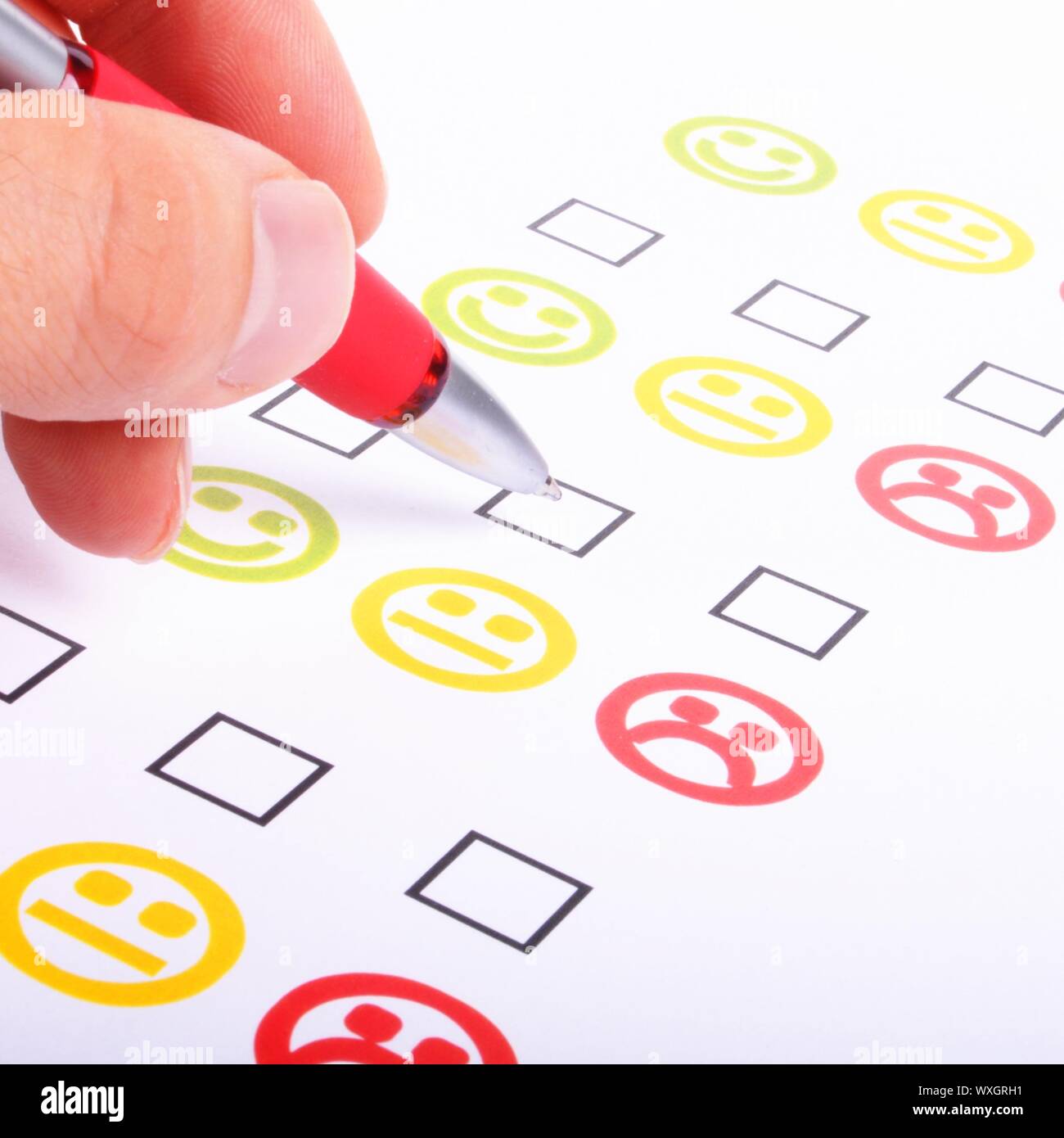 hand pen and checkbox or tickbox with smilie Stock Photo - Alamy