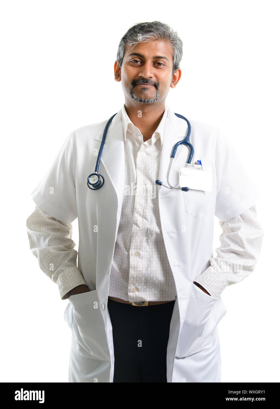Indian doctor. Mature Indian male medical doctor standing isolated on ...