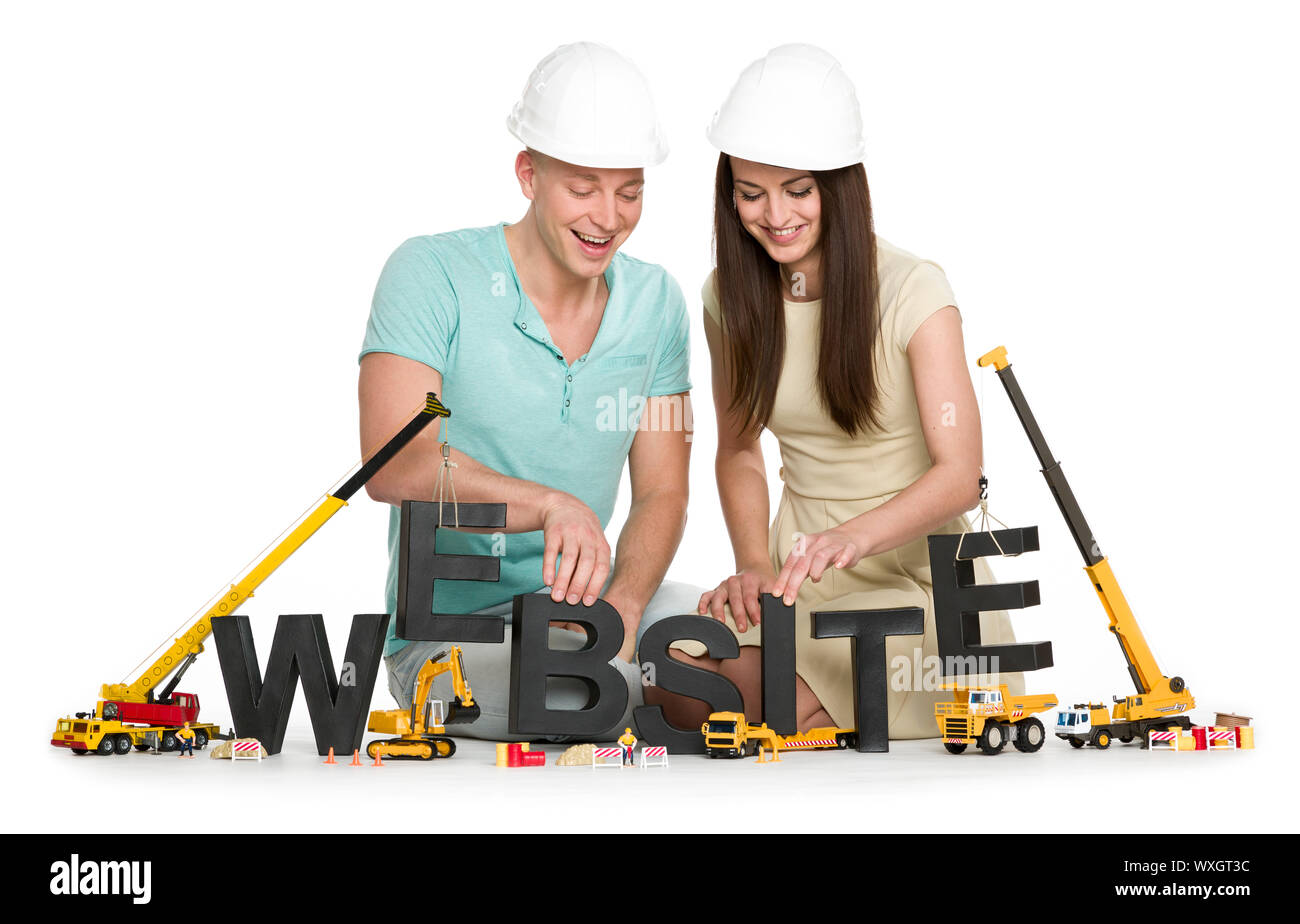 Website under construction: Joyful man and woman building website-word ...