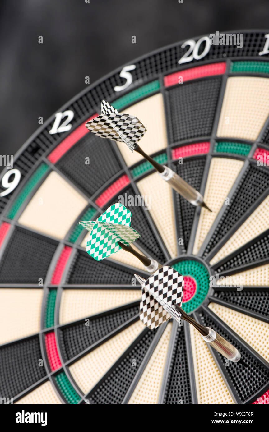 Colorful darts hit dartboard Stock Photo - Alamy