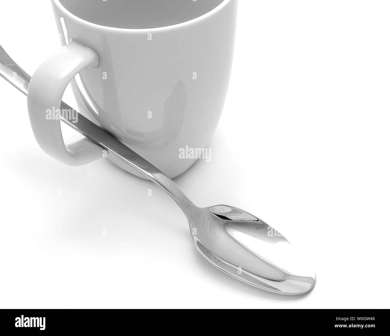 Mug and spoon Stock Photo - Alamy