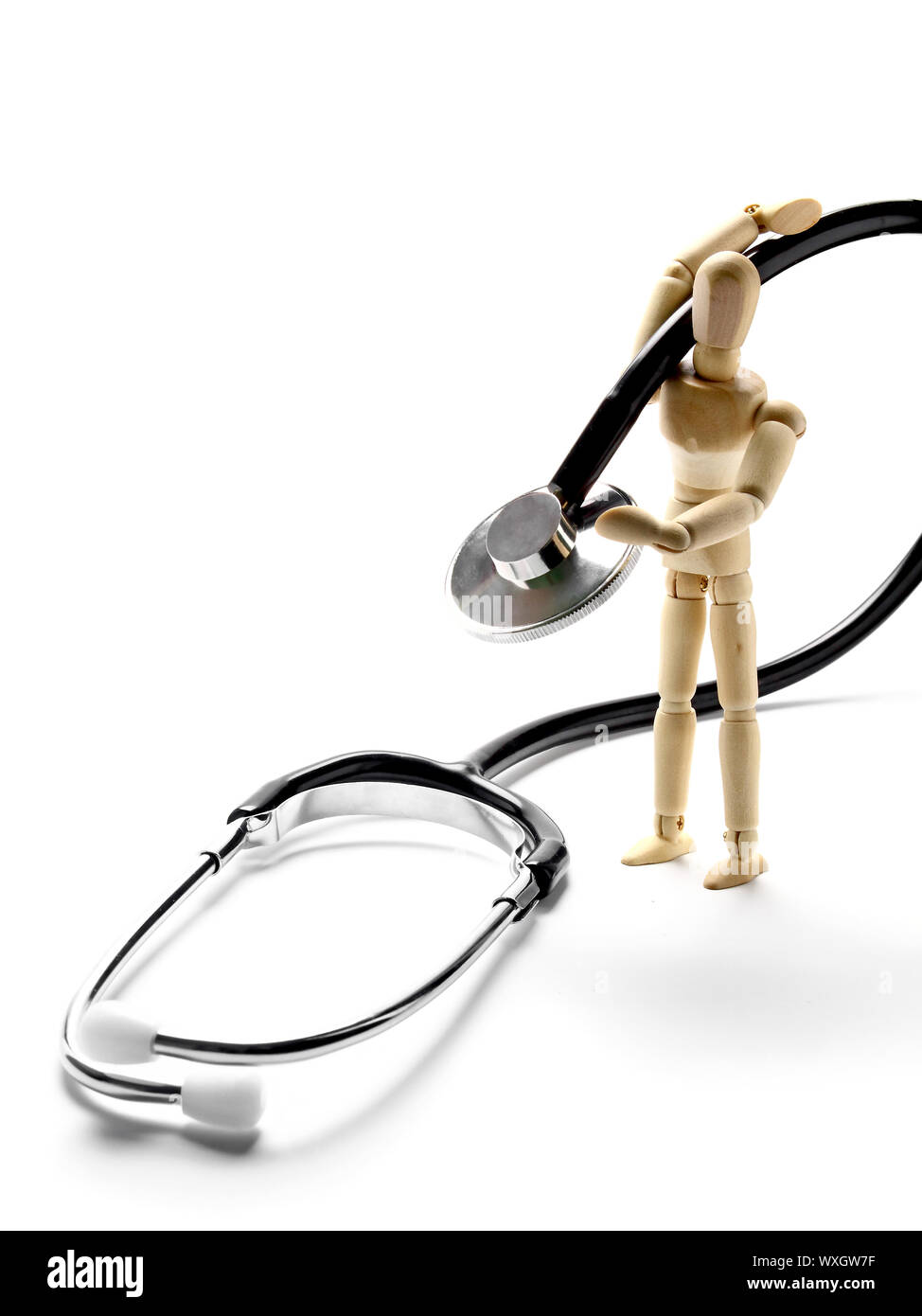 Wooden mannequin holding a stethoscope Stock Photo - Alamy