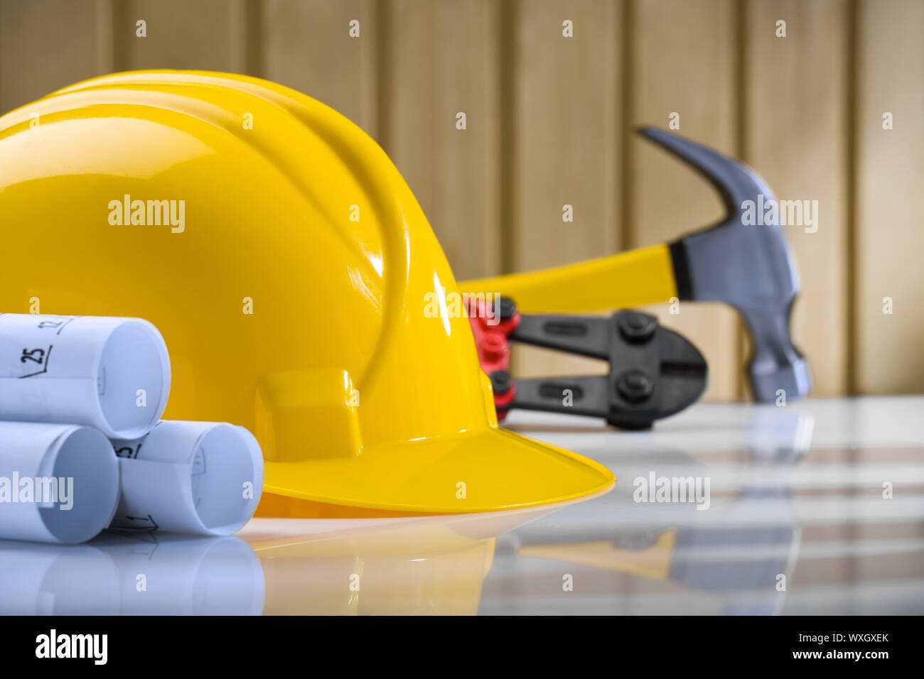 composition of helmet blueprints hammer and cutter Stock Photo - Alamy