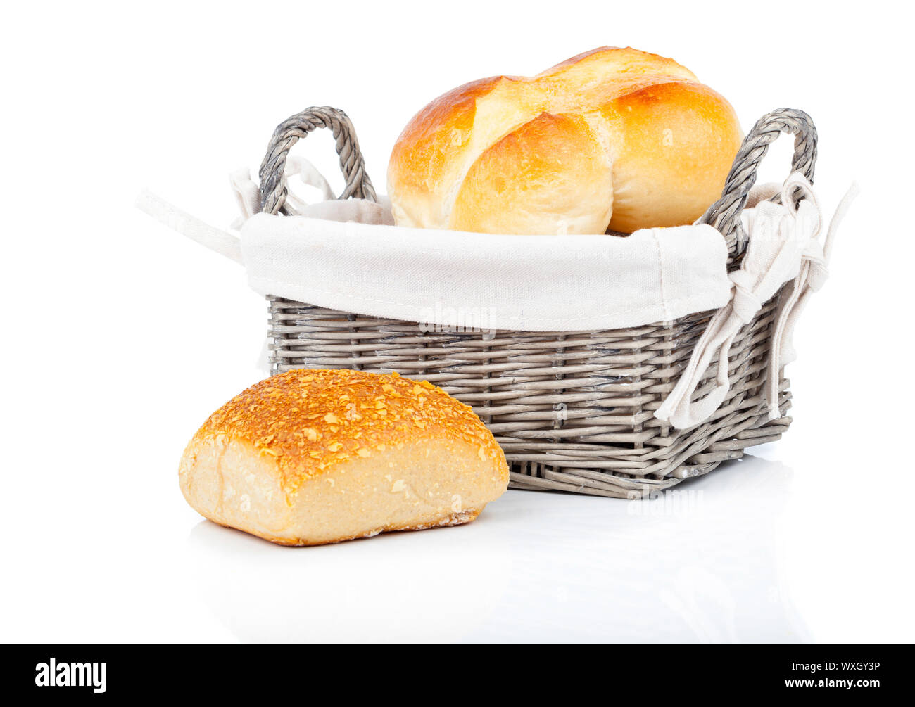 Baked bread bun in basket. isolated on white Stock Photo - Alamy
