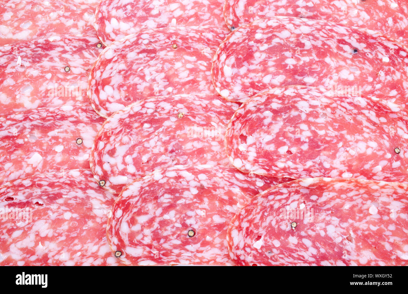 slice of french saucisson for a food background Stock Photo - Alamy