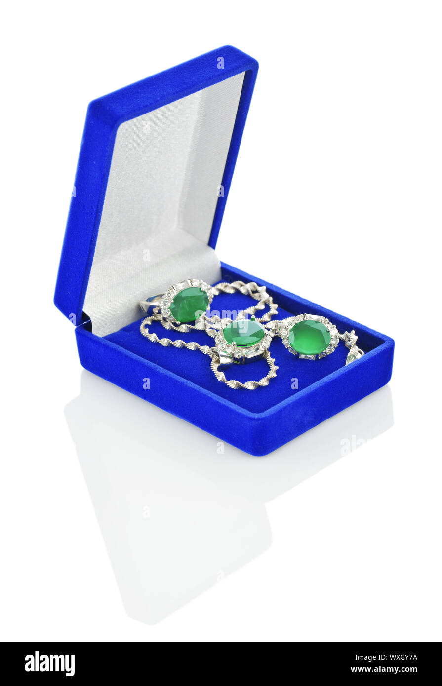 Silver jewelry in dark-blue box isolated Stock Photo - Alamy