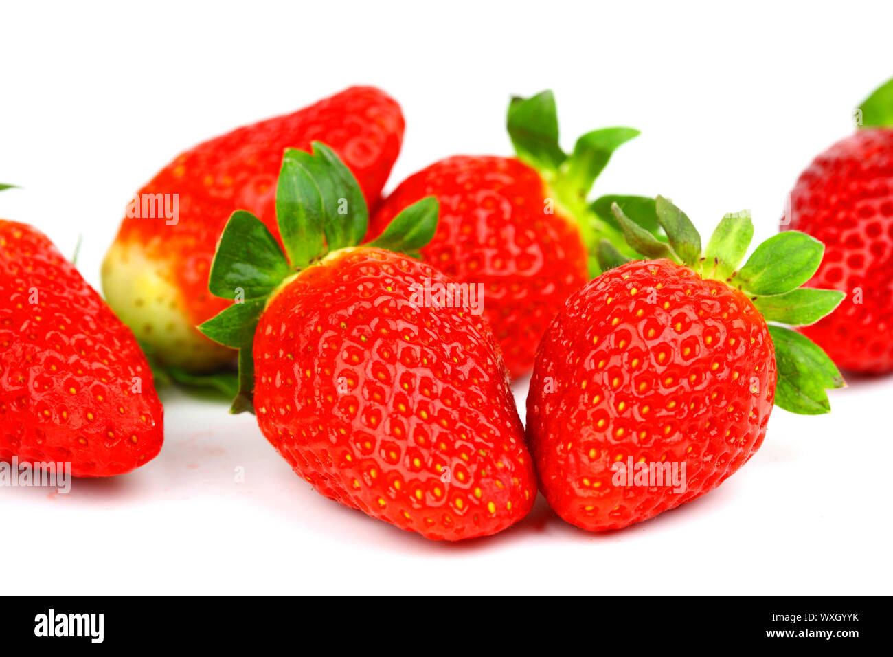 strawberry pile isolated on white background Stock Photo - Alamy