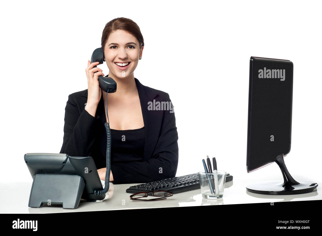 Young personal assistant attending call Stock Photo - Alamy