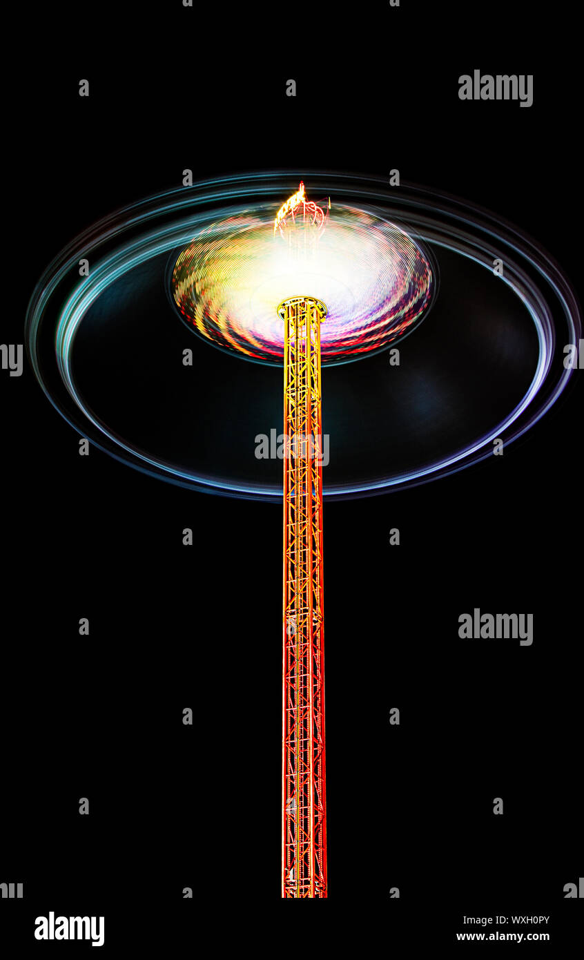 fast merry-go-round by night with great lights Stock Photo - Alamy