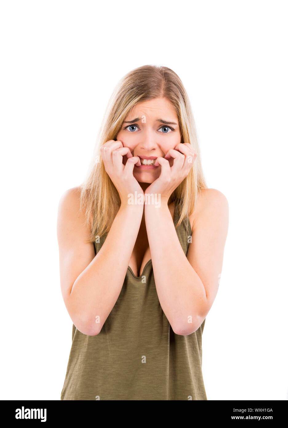 Beautiful blonde woman with a fear expression, isolated over white ...