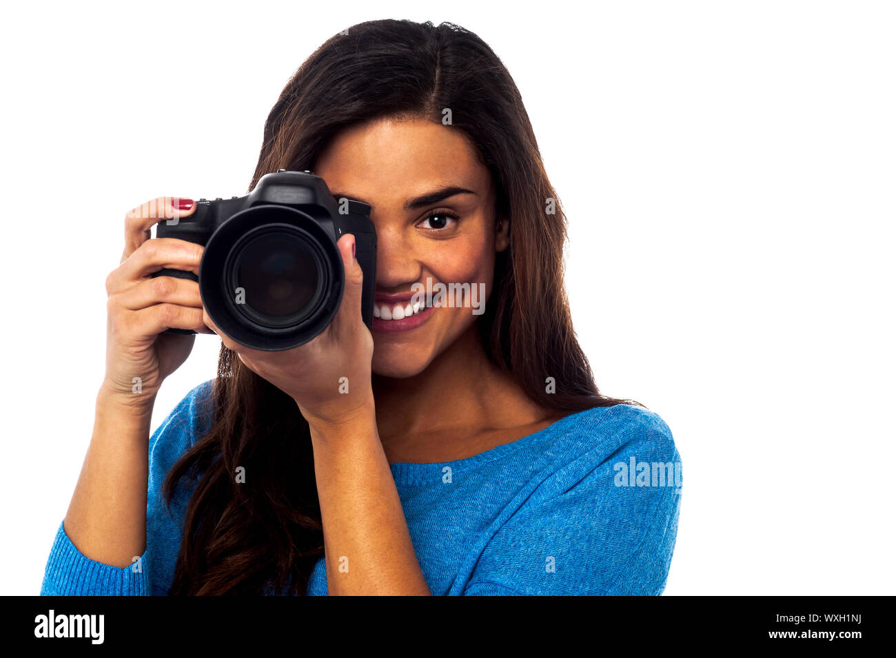 Female photographer focusing to capture your snap Stock Photo - Alamy
