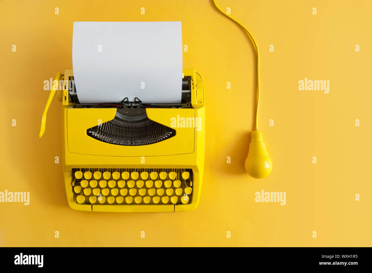 Retro typewriter with yellow light bulb, new idea, creativity Stock ...