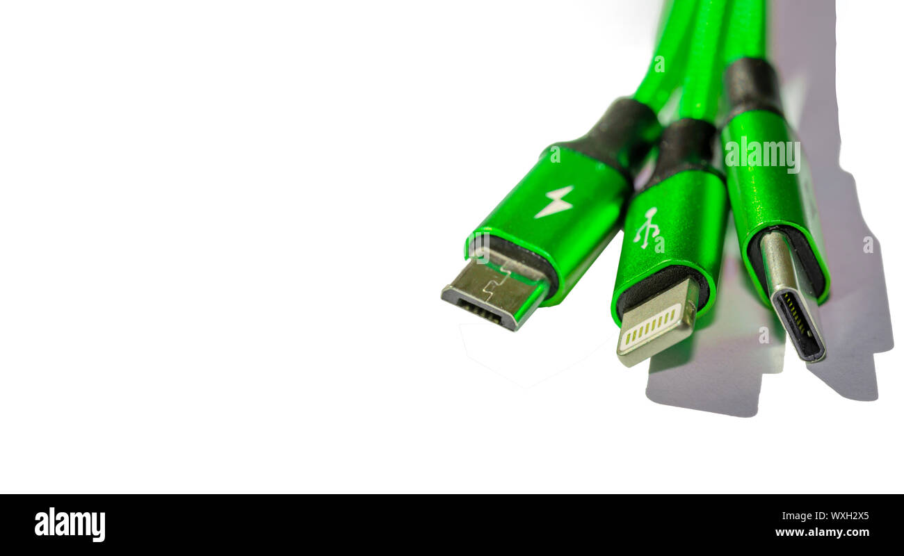 three cord charger to a green smartphone isolate on white background ...