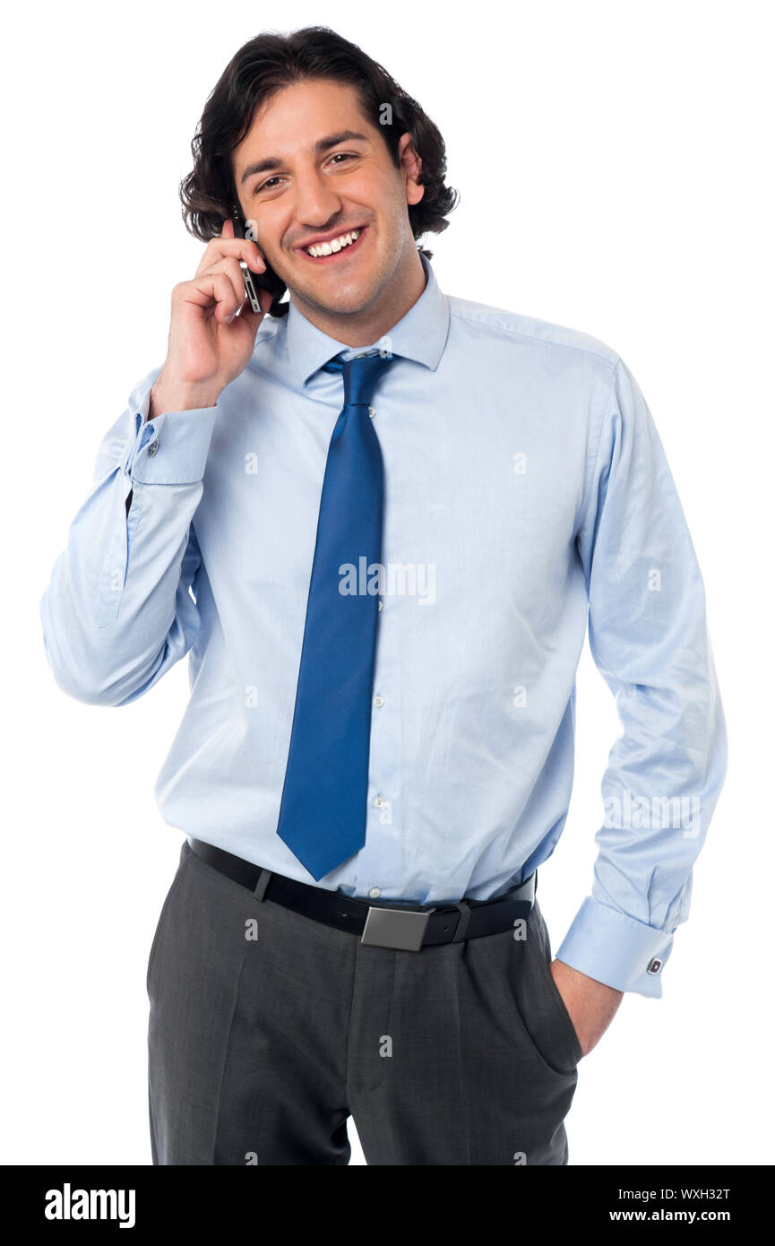 Young professional assisting client over a phone call Stock Photo - Alamy