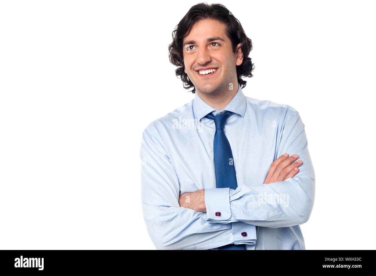 Smart male executive looking at something and smiling Stock Photo - Alamy