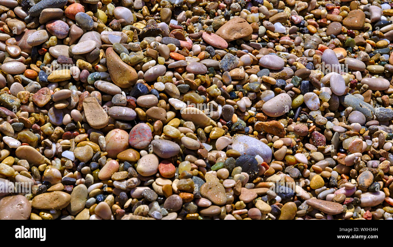 Beach colorful pebbles close up panorama background Stock Photo - Alamy