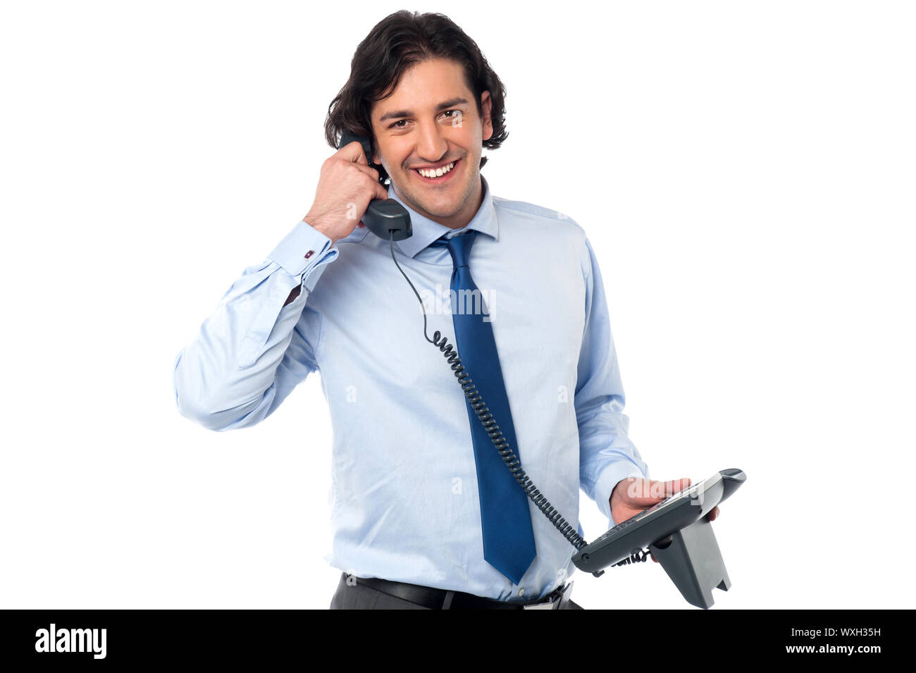 Handsome male executive answering the phone call Stock Photo - Alamy