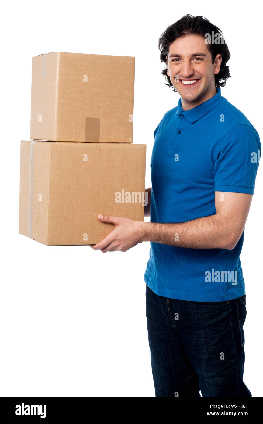 Handsome guy transferring cardboard boxes Stock Photo - Alamy