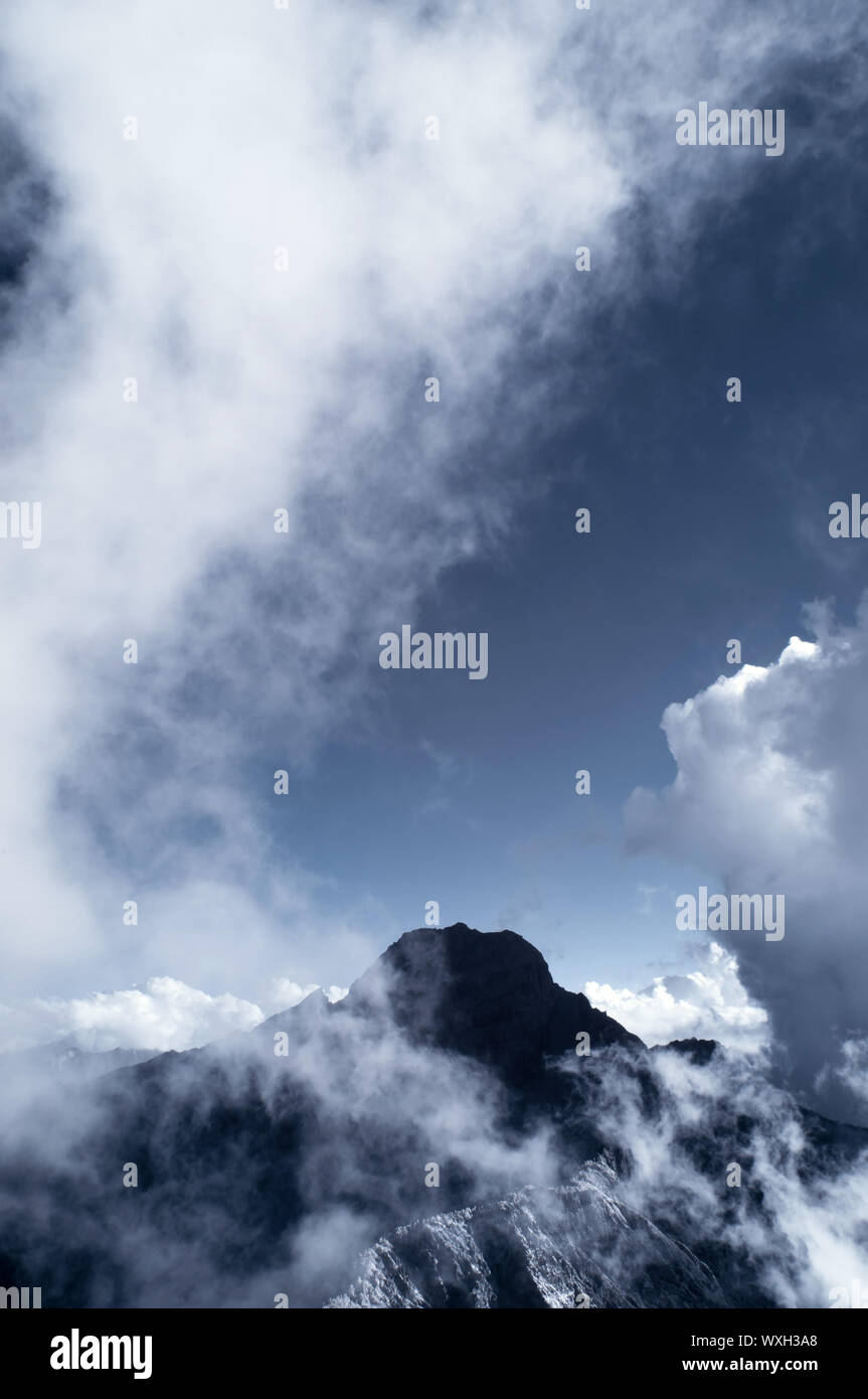 Mountain scenery with clouds and mist, the peak is famous Mt Jade in ...