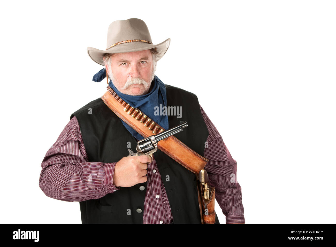 Big and tough cowboy with a pistol ready to fire Stock Photo - Alamy