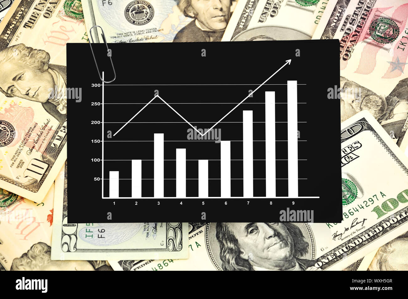 pappaper with graph on money background Stock Photo - Alamy