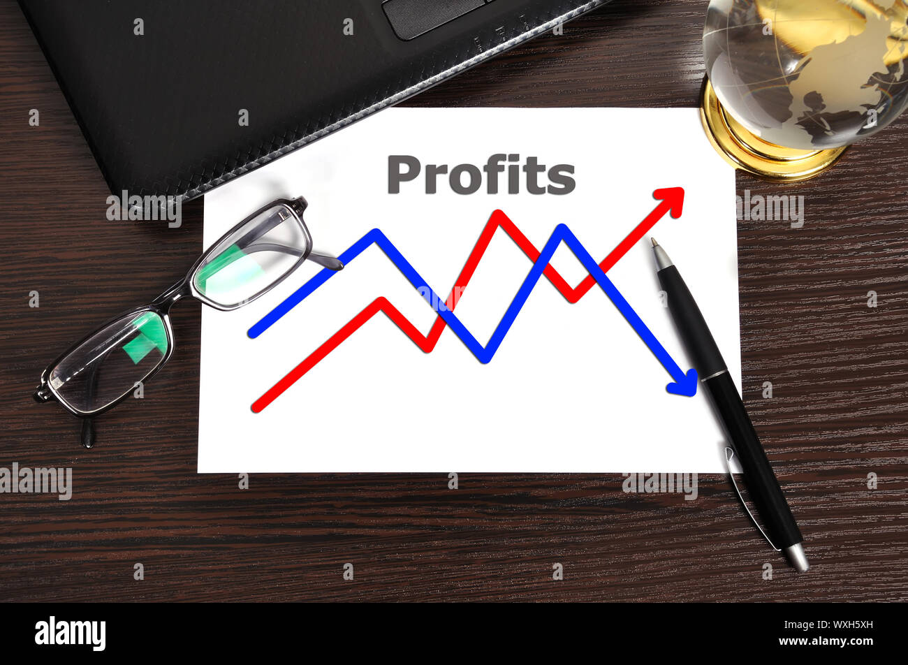 workplace with growth chart on paper Stock Photo - Alamy