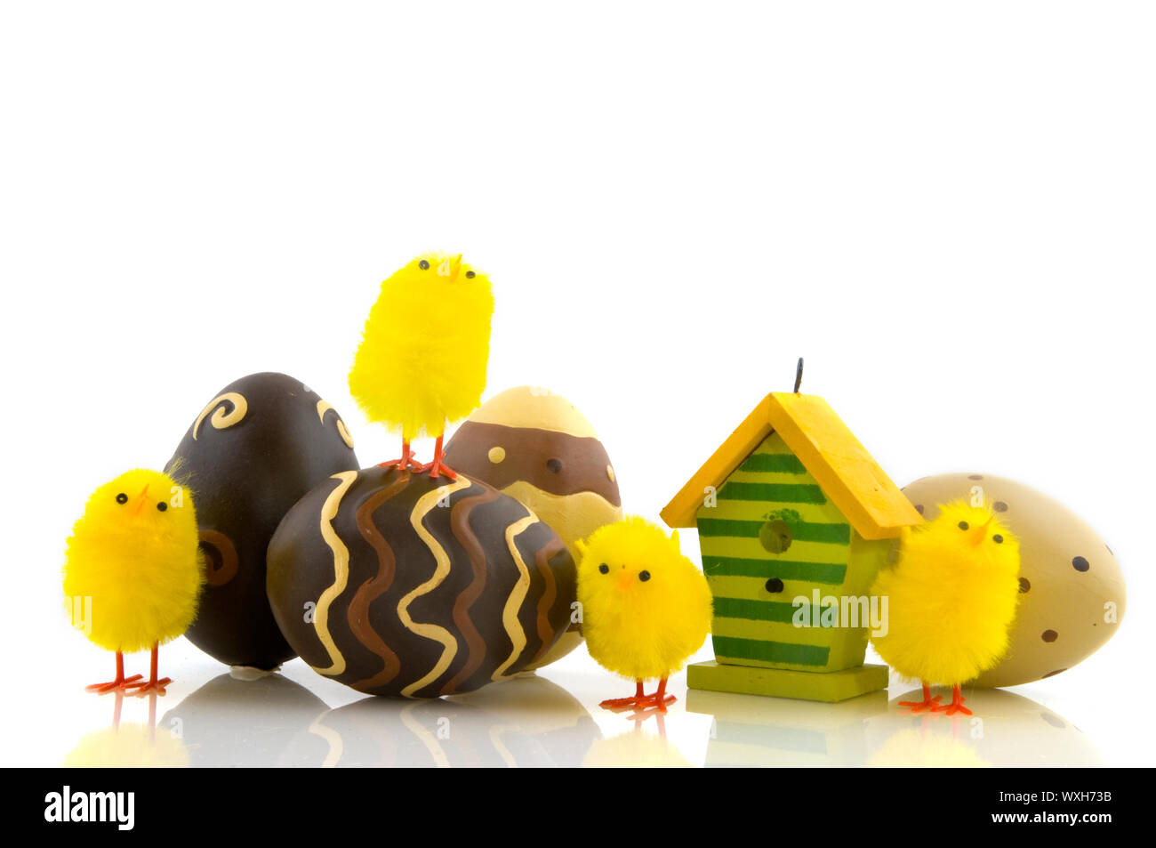 easter eggs and chicks with bird house Stock Photo - Alamy