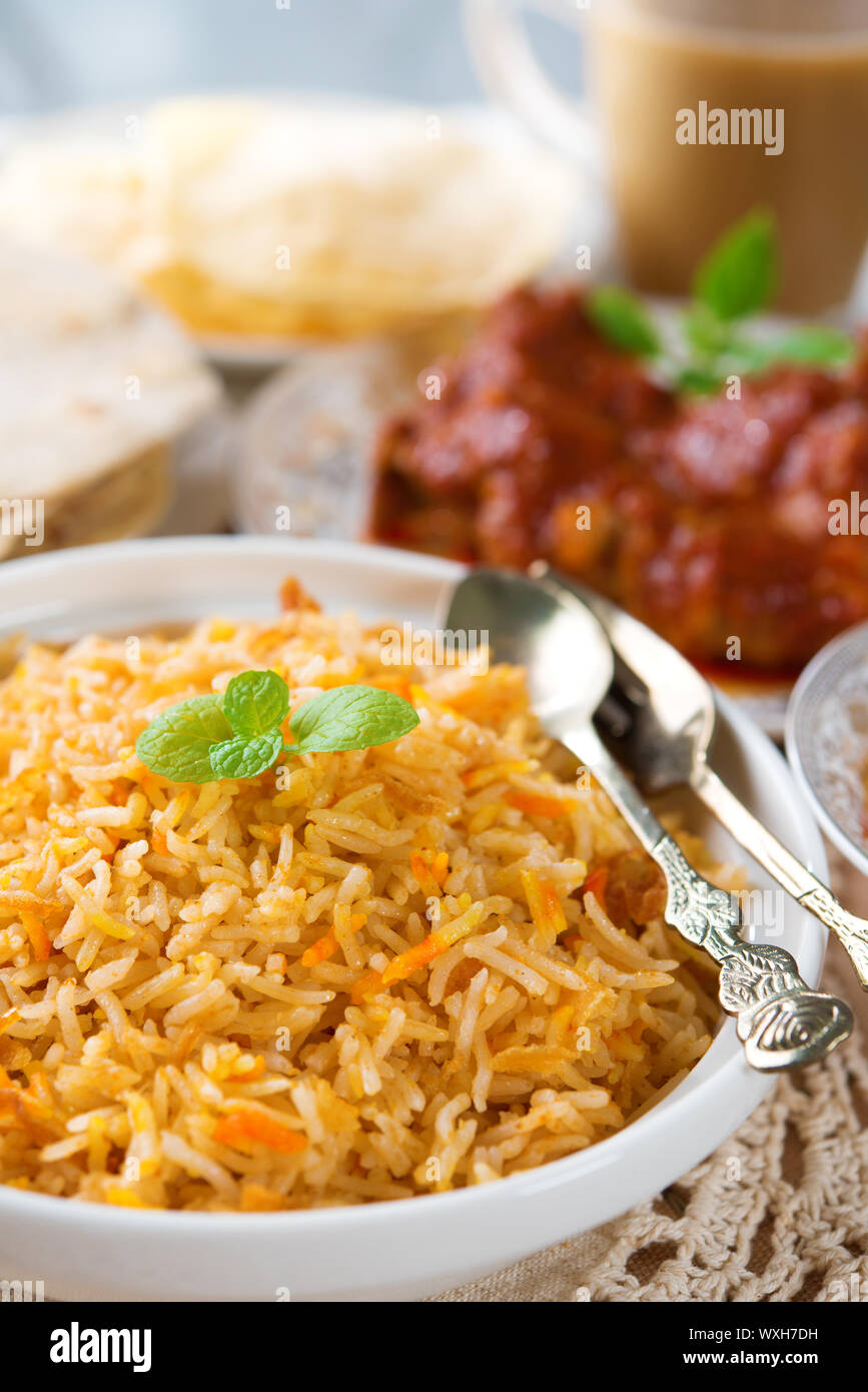 Indian cuisine biryani rice and chicken curry Stock Photo - Alamy