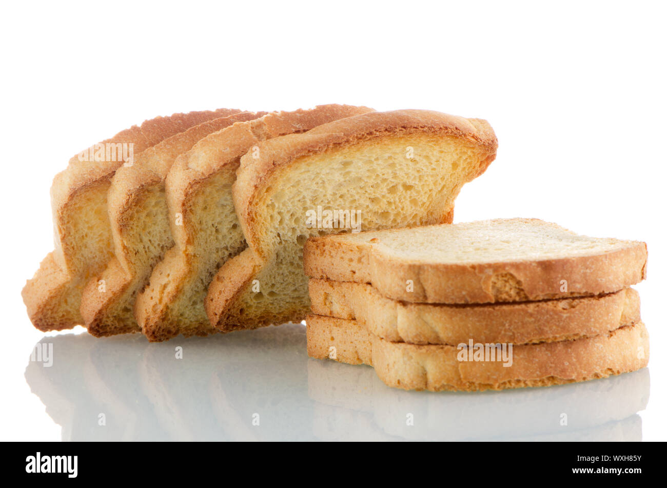 Several pieces of golden brown toast on white background Stock Photo ...