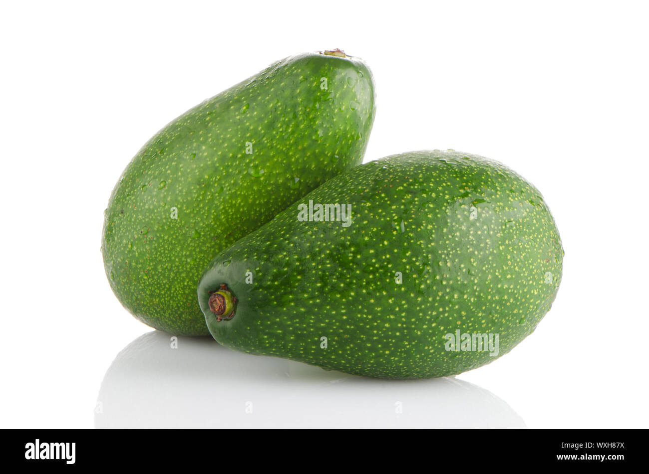 Avocado fruits on white background Stock Photo - Alamy