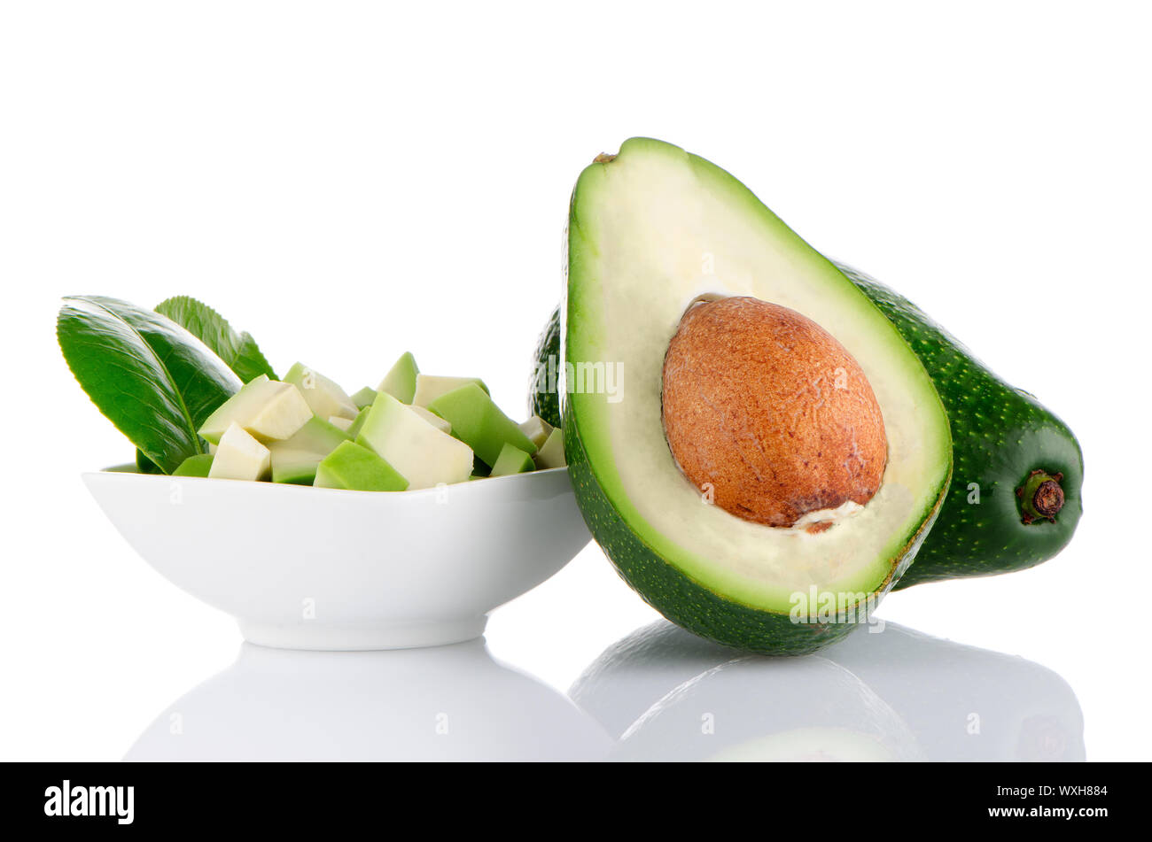 Avocado fruits on white background Stock Photo - Alamy