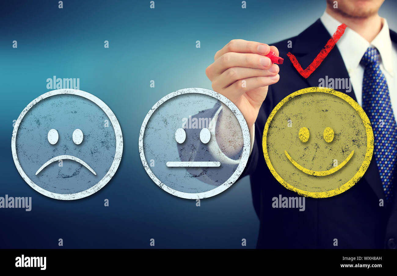 Business man drawing a check on smiley face Stock Photo - Alamy