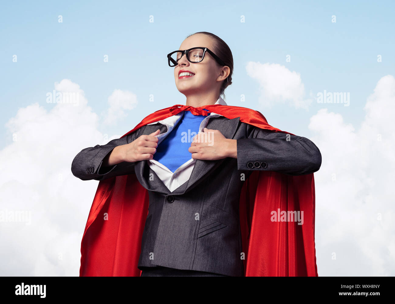 Portrait of business woman super heroine tearing off her shirt. Smiling ...