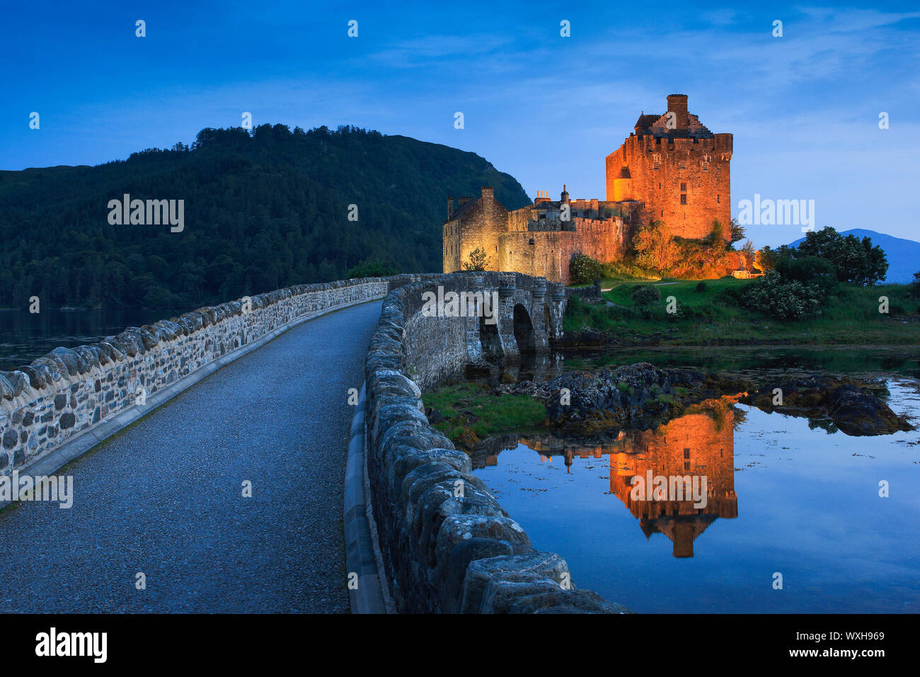 Eilean Donan Castle in the evening. The castle is built in a small ...