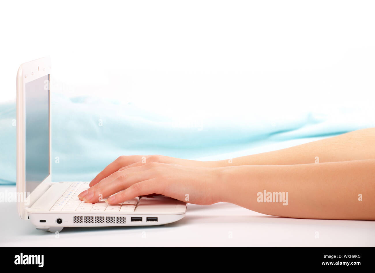 Typing hands on the cool small notebook Stock Photo - Alamy