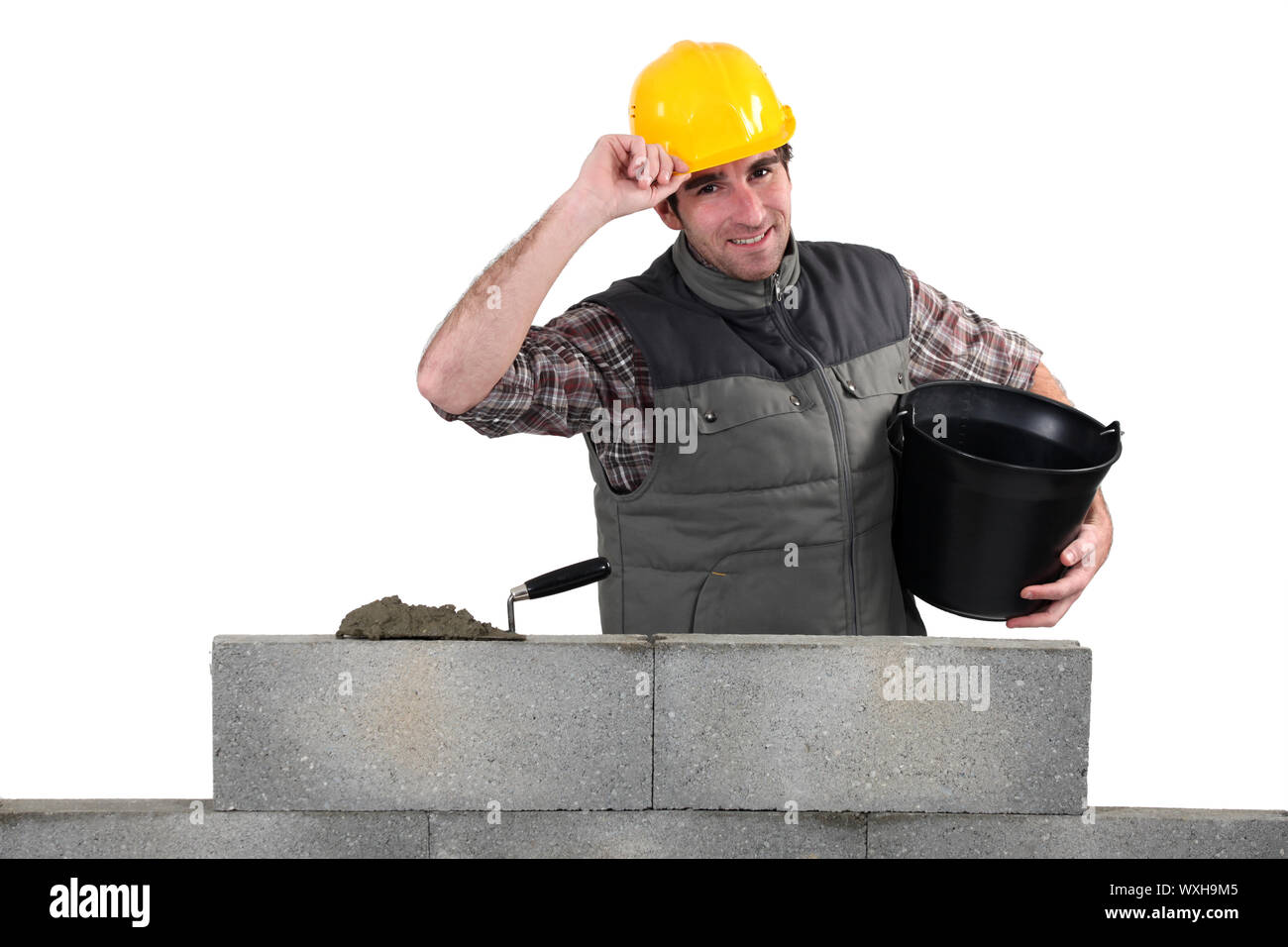 Man building stone wall Stock Photo - Alamy