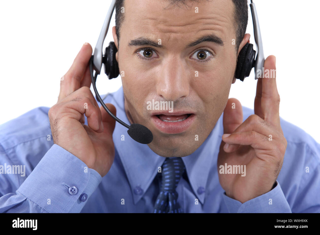 Call centre operator looking shocked Stock Photo - Alamy