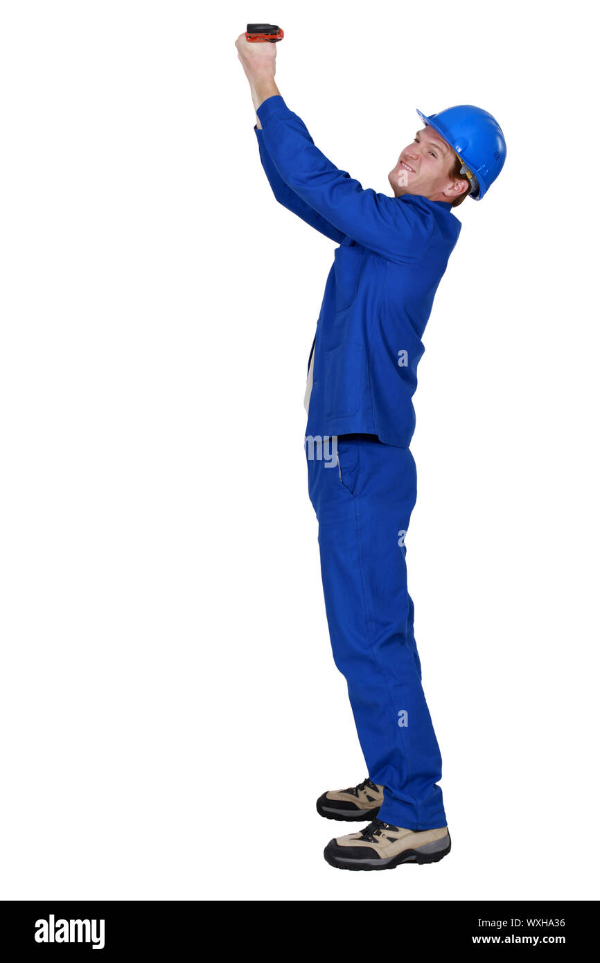 Mechanic holding part Cut Out Stock Images & Pictures - Alamy