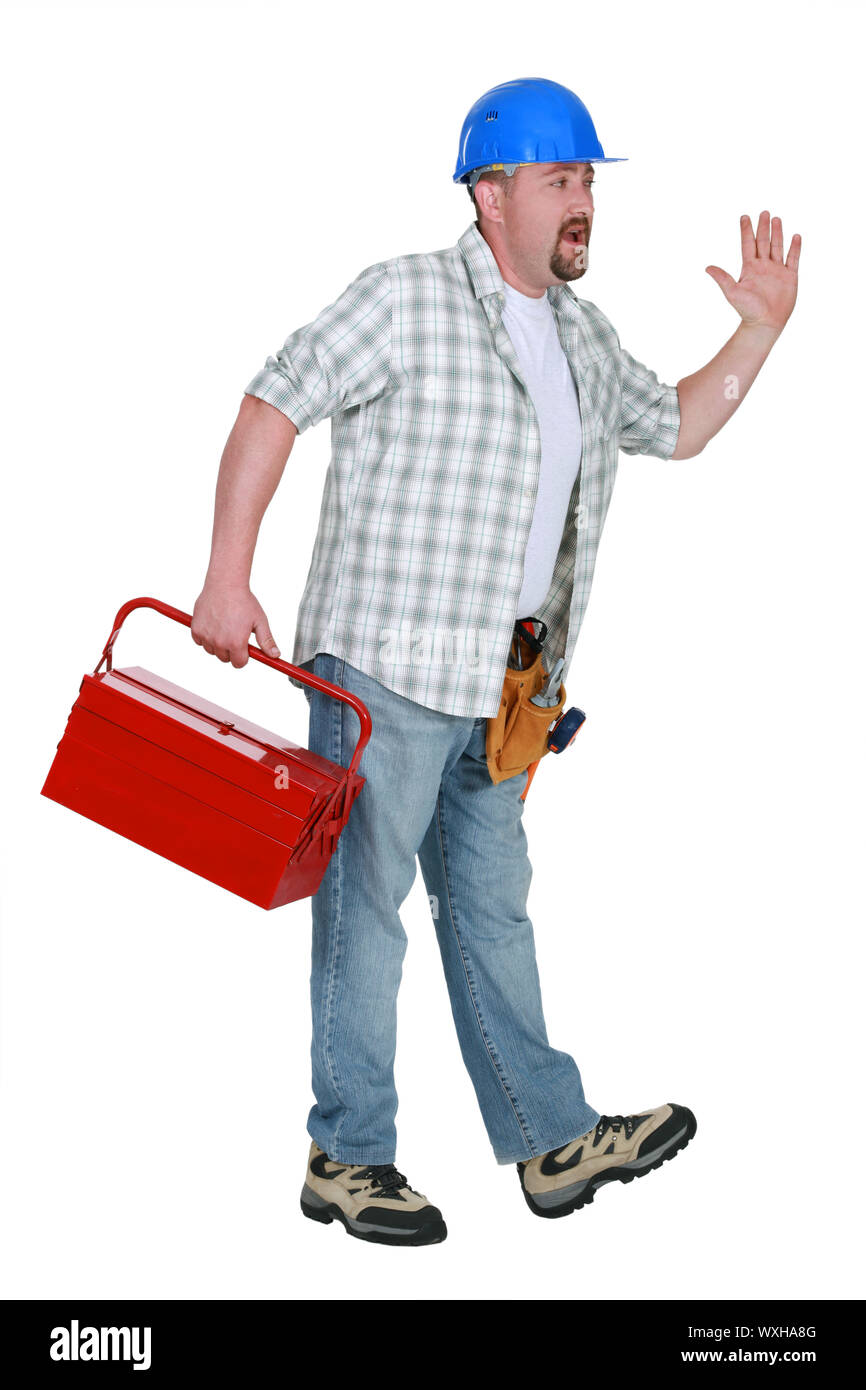 Worker with a toolbox waving Stock Photo - Alamy
