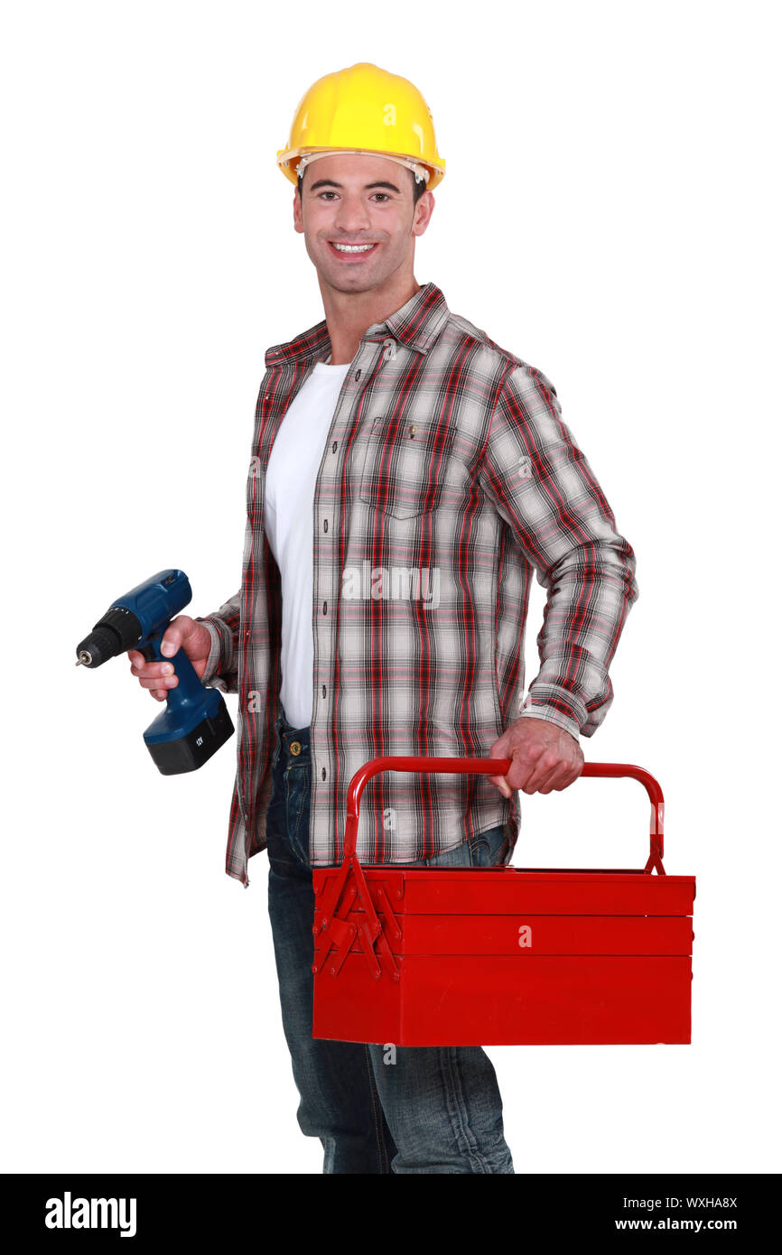 Man with a toolbox and powerdrill Stock Photo - Alamy