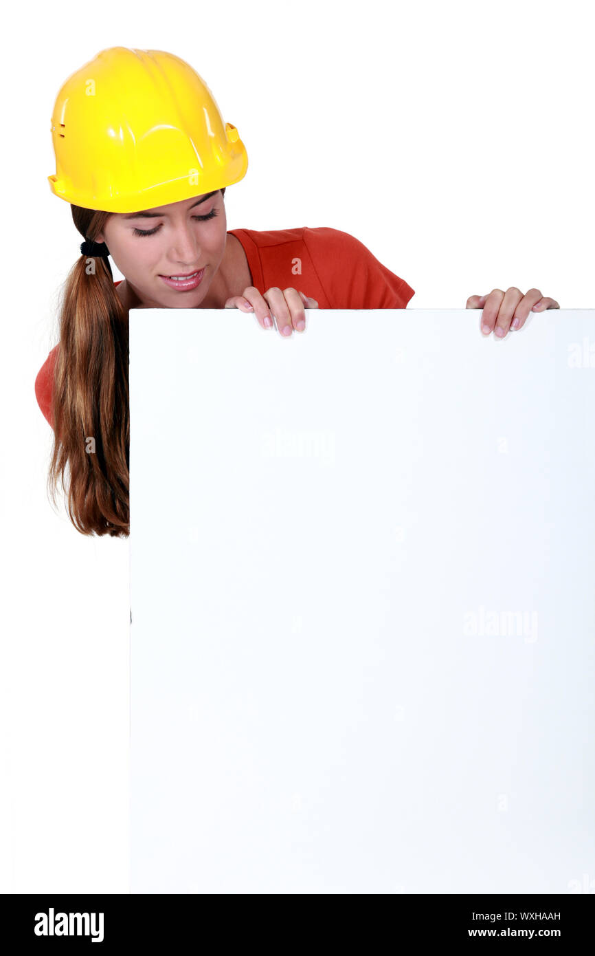 Female laborer with a blank board Stock Photo - Alamy