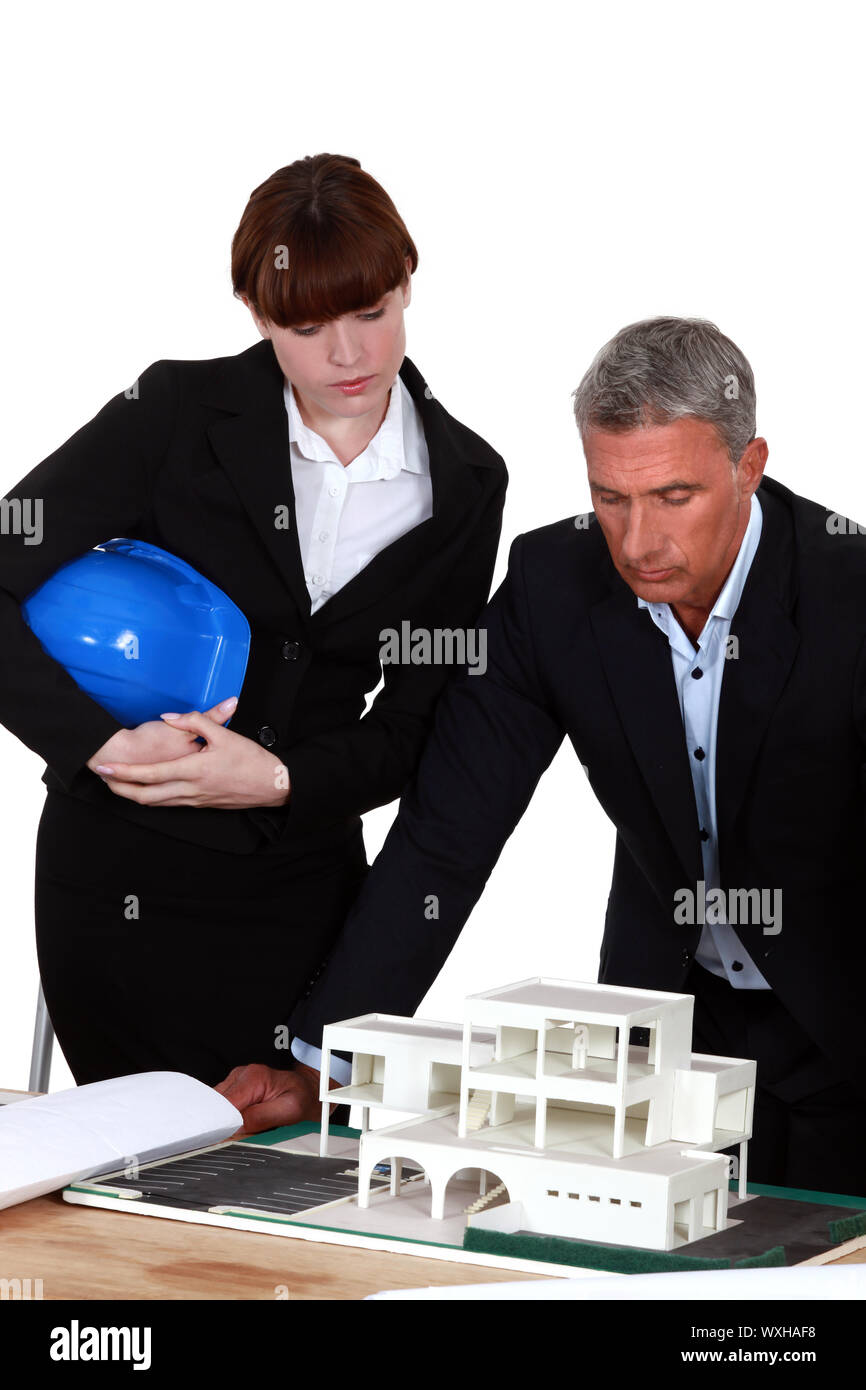Architects looking at designs Stock Photo - Alamy