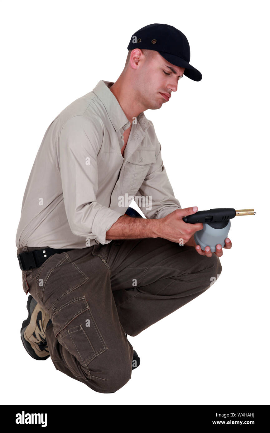 craftsman holding a welding torch Stock Photo - Alamy