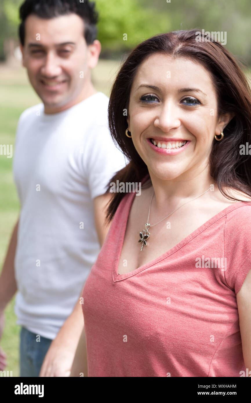 Happy woman with her husband in the park Stock Photo - Alamy