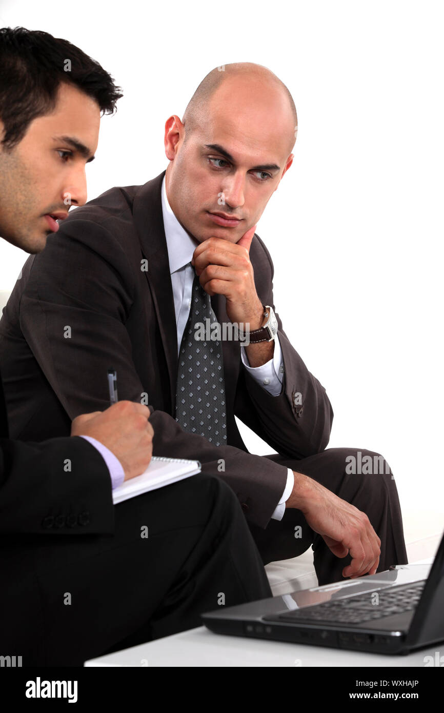 Two businessmen problem solving Stock Photo - Alamy