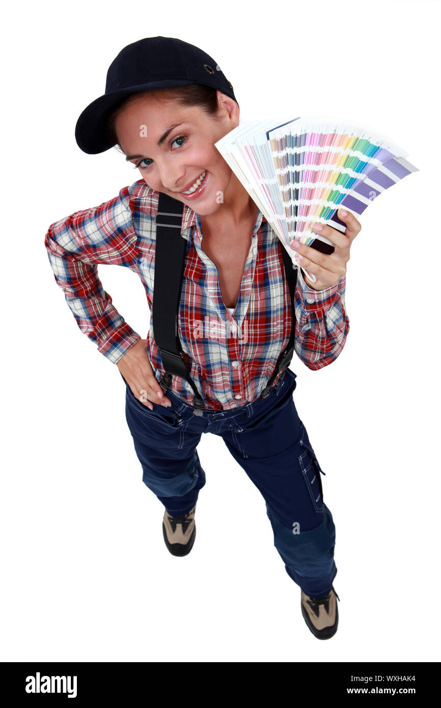 Woman displaying paint colour samples Stock Photo - Alamy