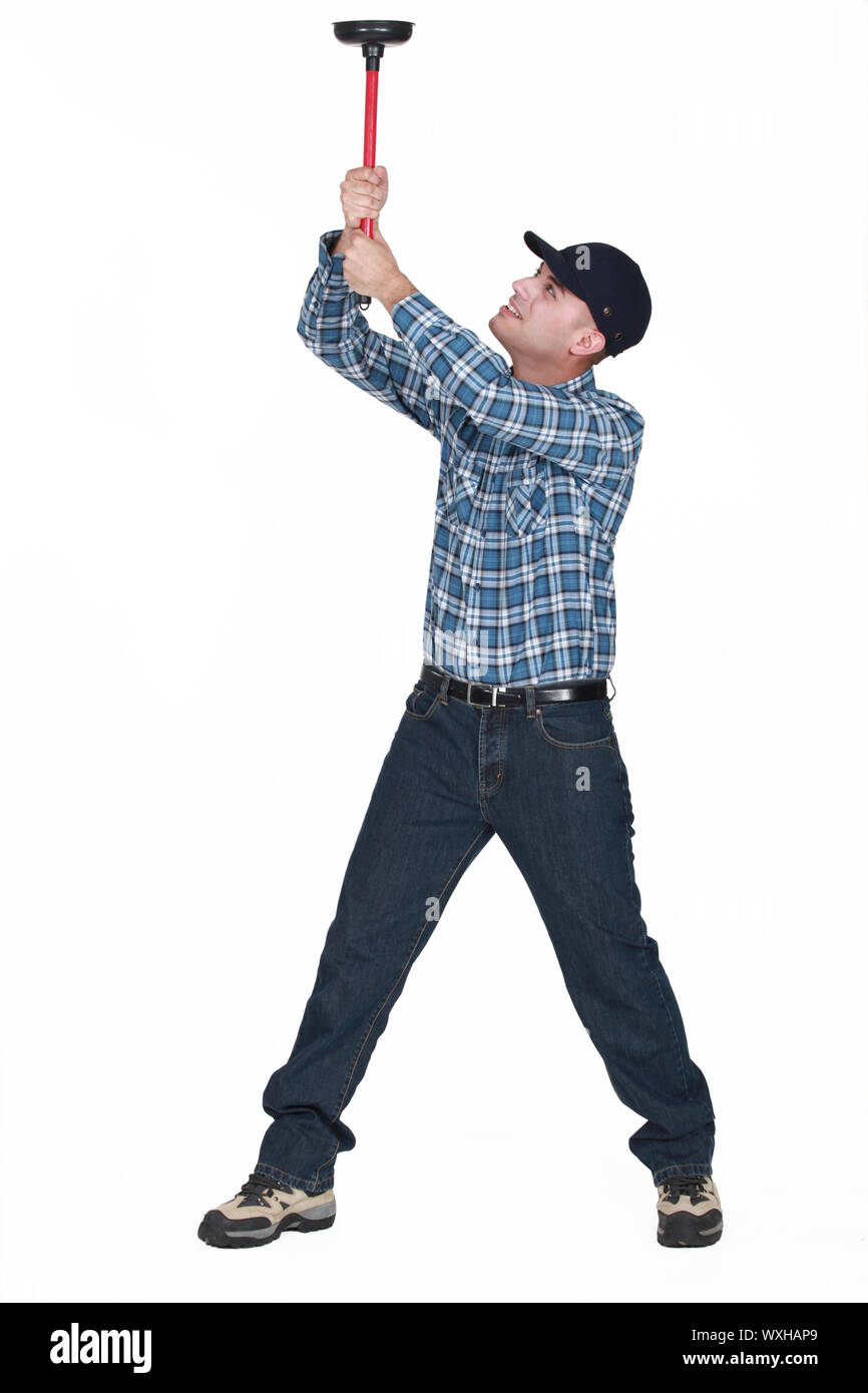 Man with a plunger Stock Photo - Alamy