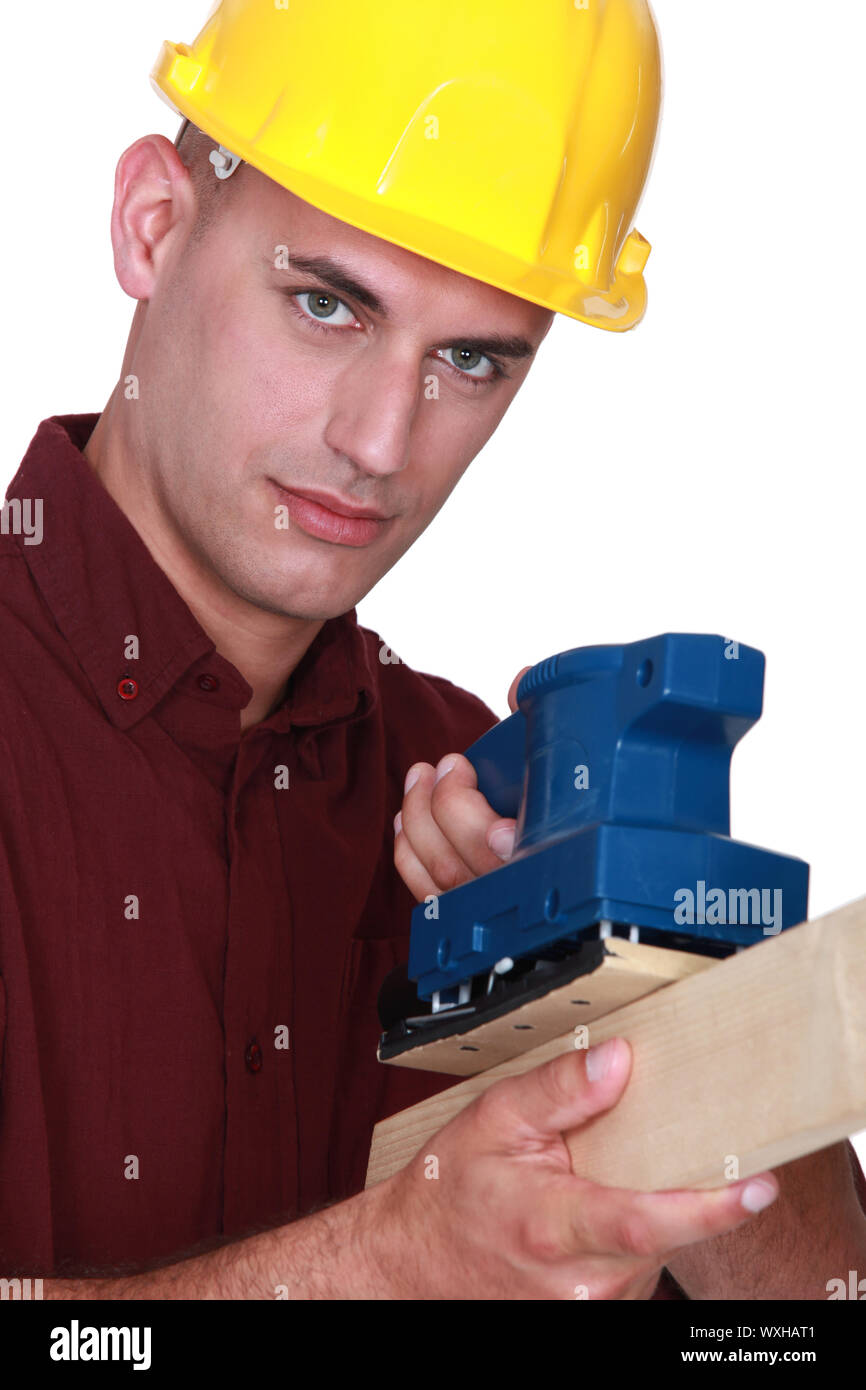 Man with an electric sander Stock Photo - Alamy