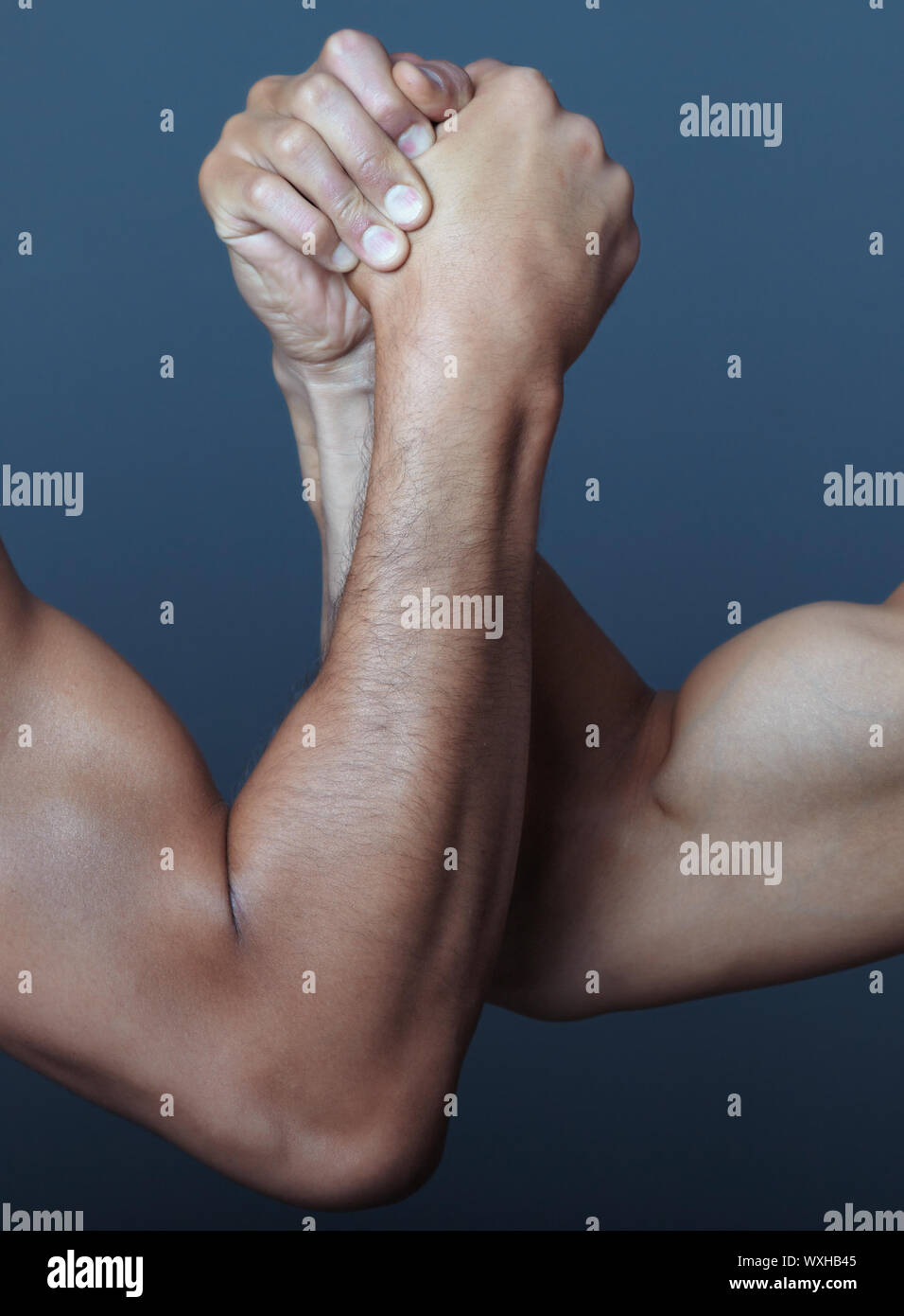 Two hands doing arm wrestling Stock Photo - Alamy