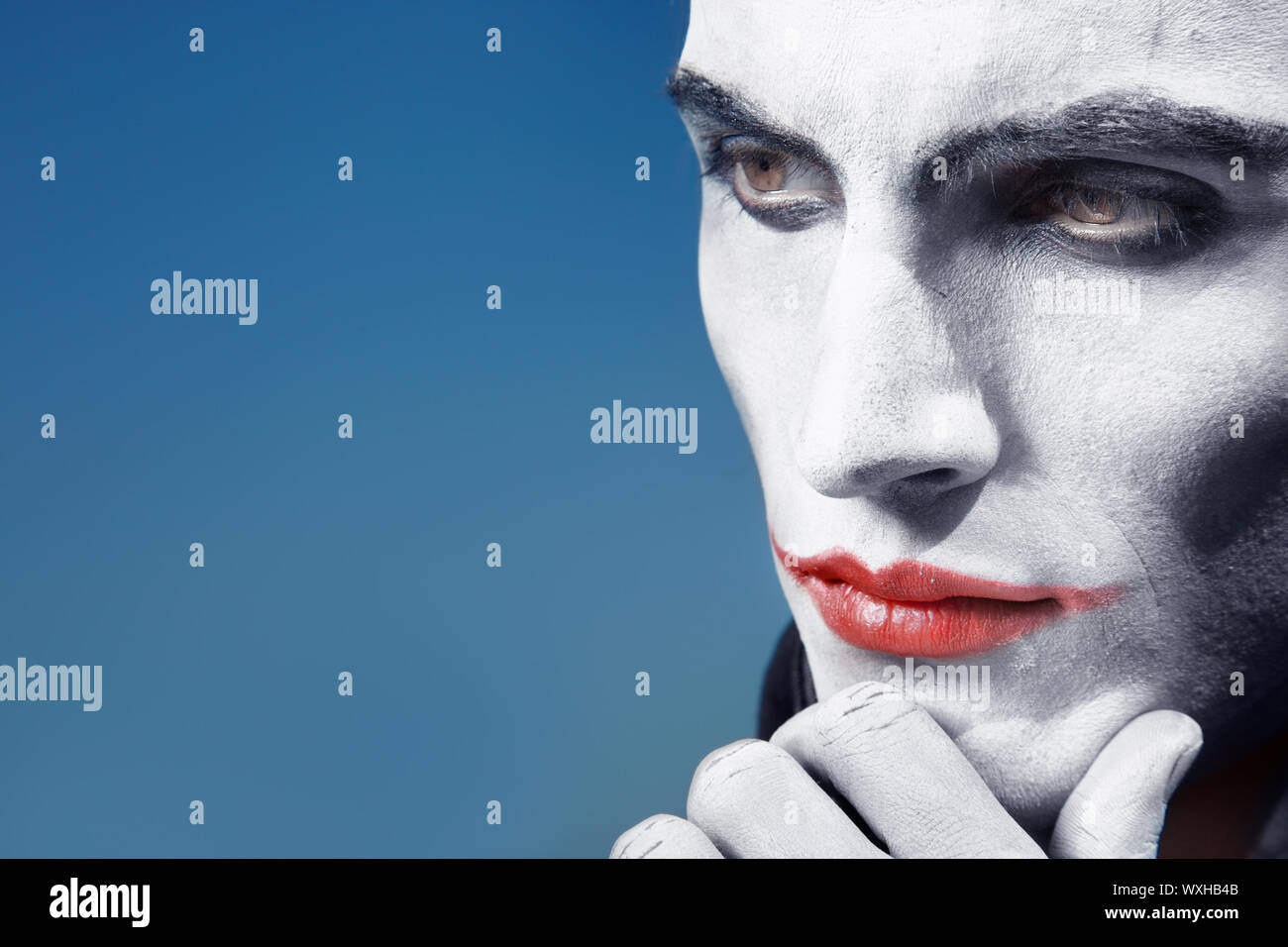 Alone clown thinking outdoors. Horizontal photo. Artistic darkness and ...